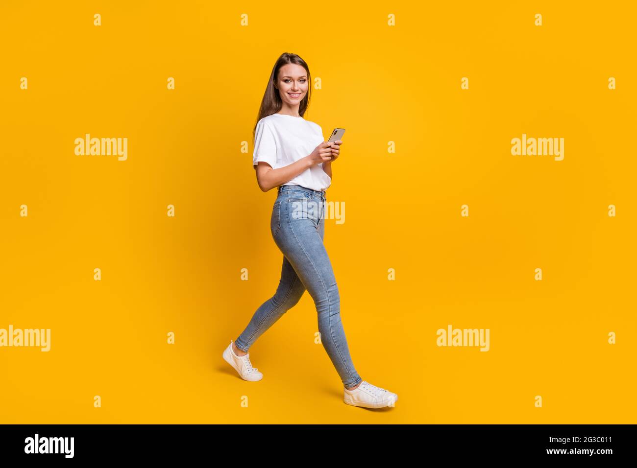 Full length body size photo of girl stepping forward using smartphone ...