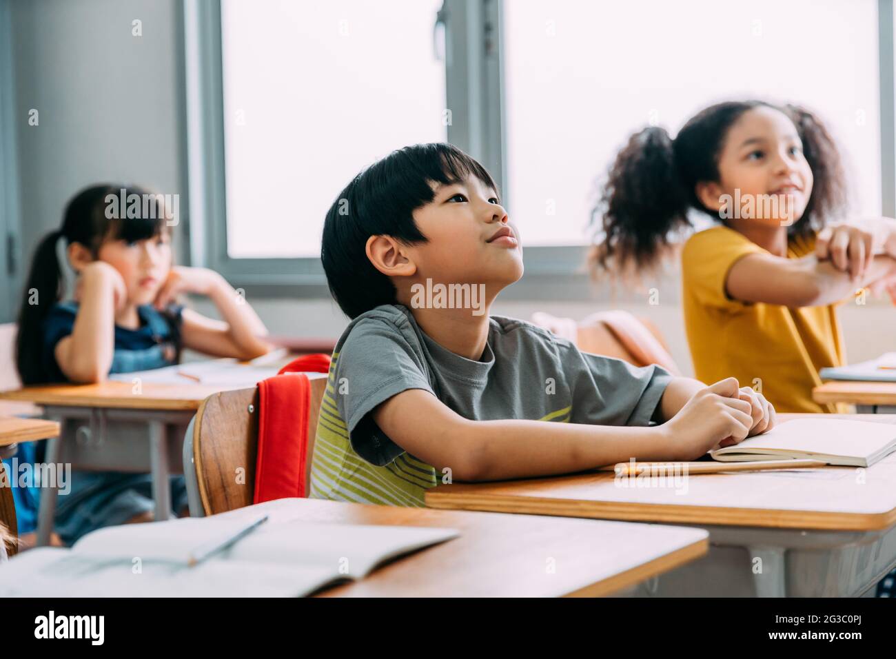 Curious and excited cute little boys and girls listening and attending ...