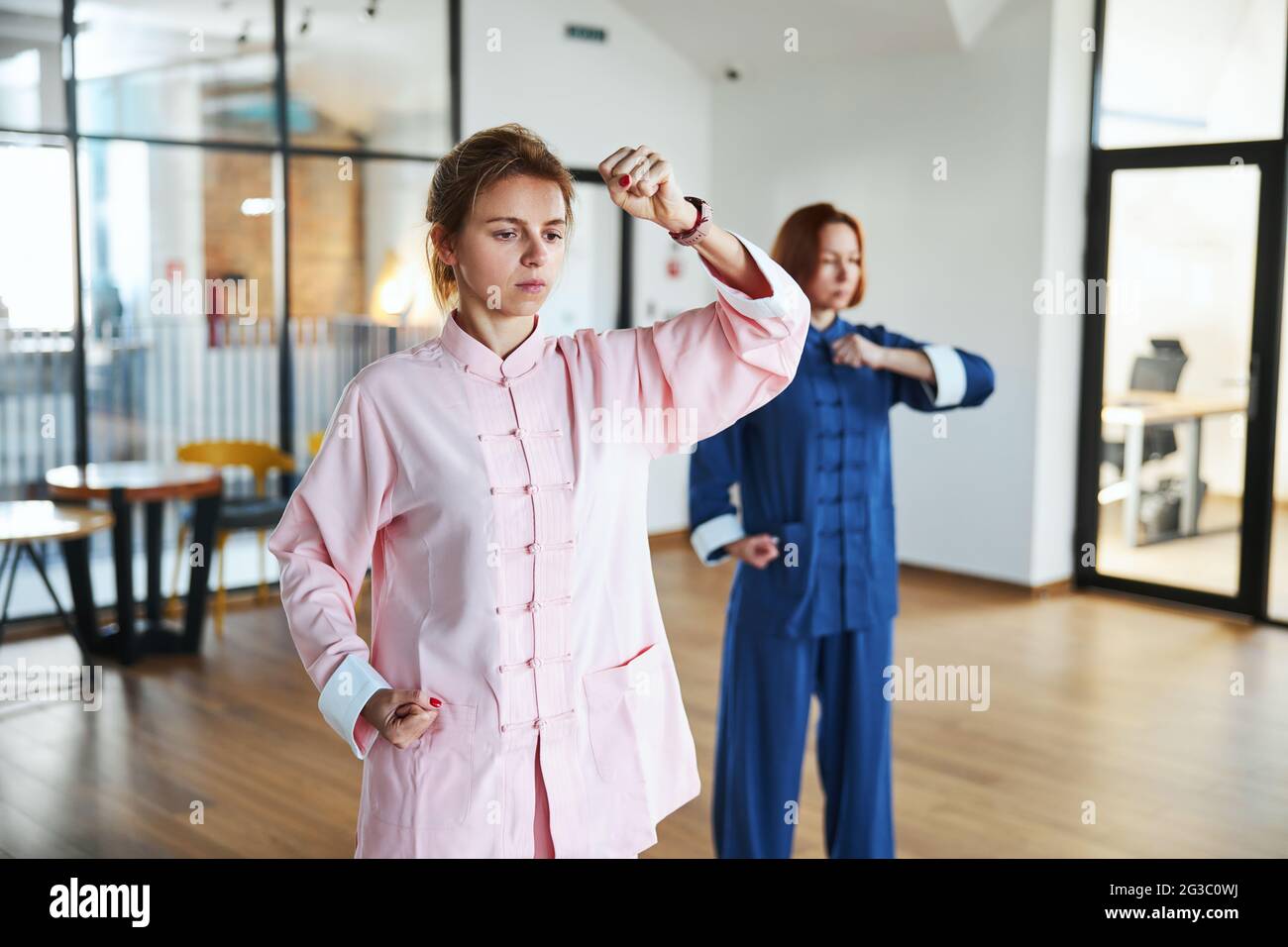 Clenching fists and coordinating movements at the practice Stock Photo ...