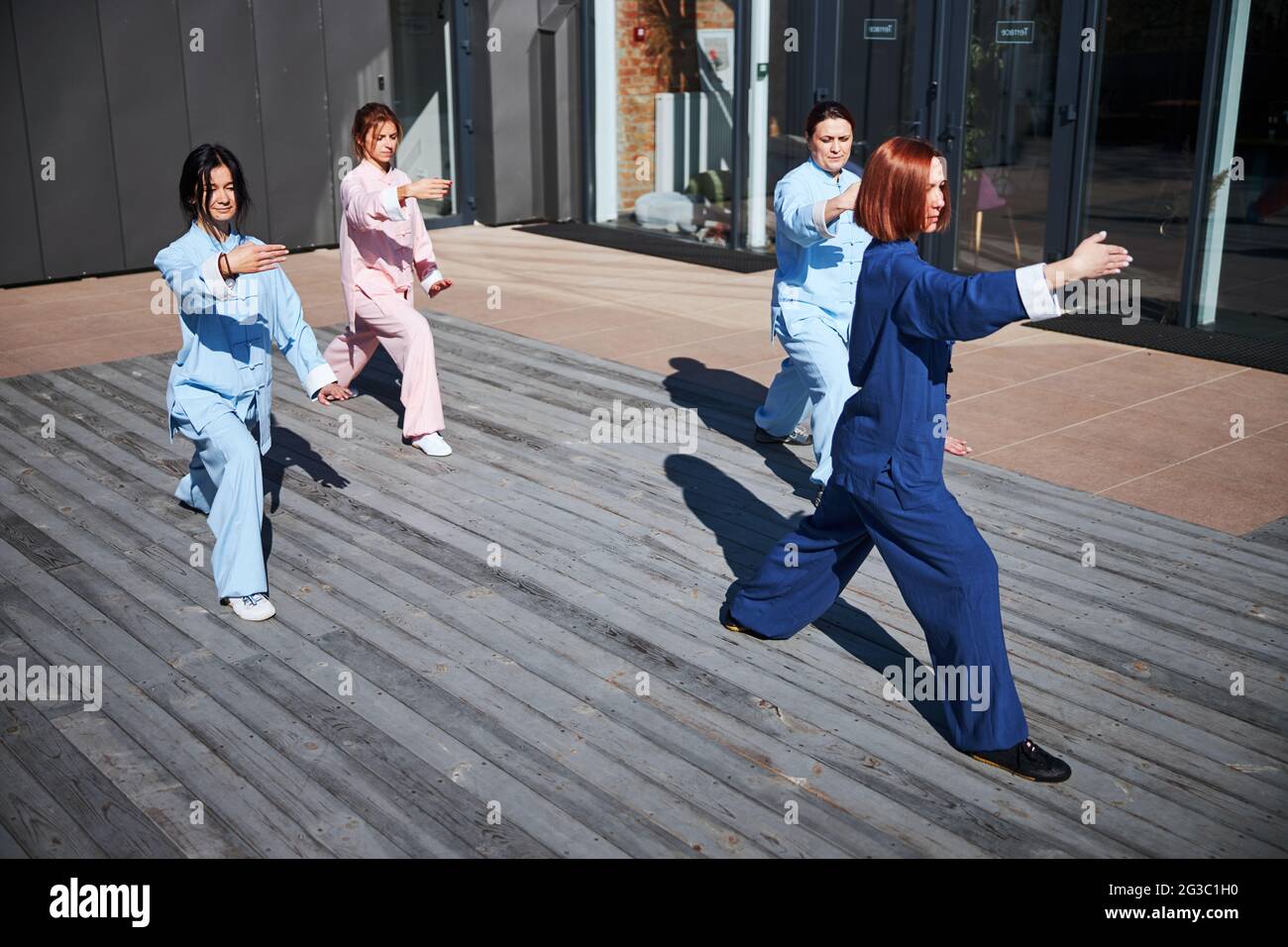 Conscious movements and breathing exercises at qigong training Stock ...