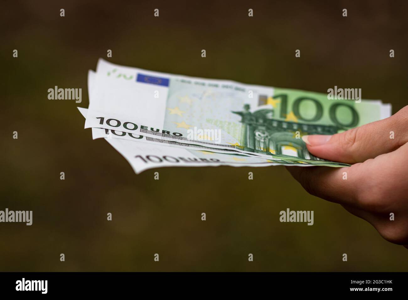 Selective focus on detail of EURO banknotes. Counting or giving EURO ...