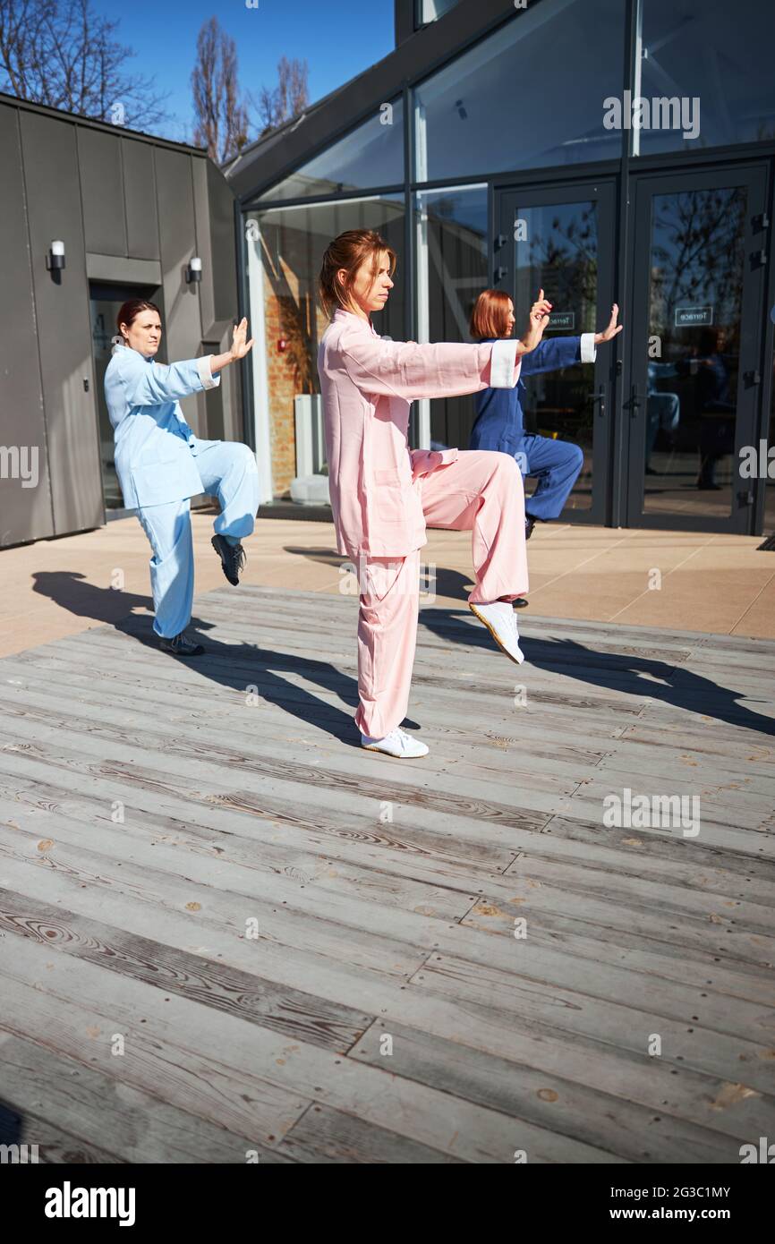Balancing on one foot and practicing deep breathing Stock Photo - Alamy