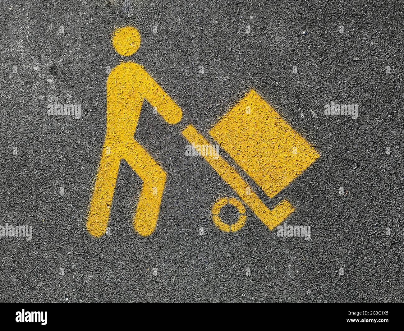 Yellow parking symbol for loading and unloading goods on the ground ...