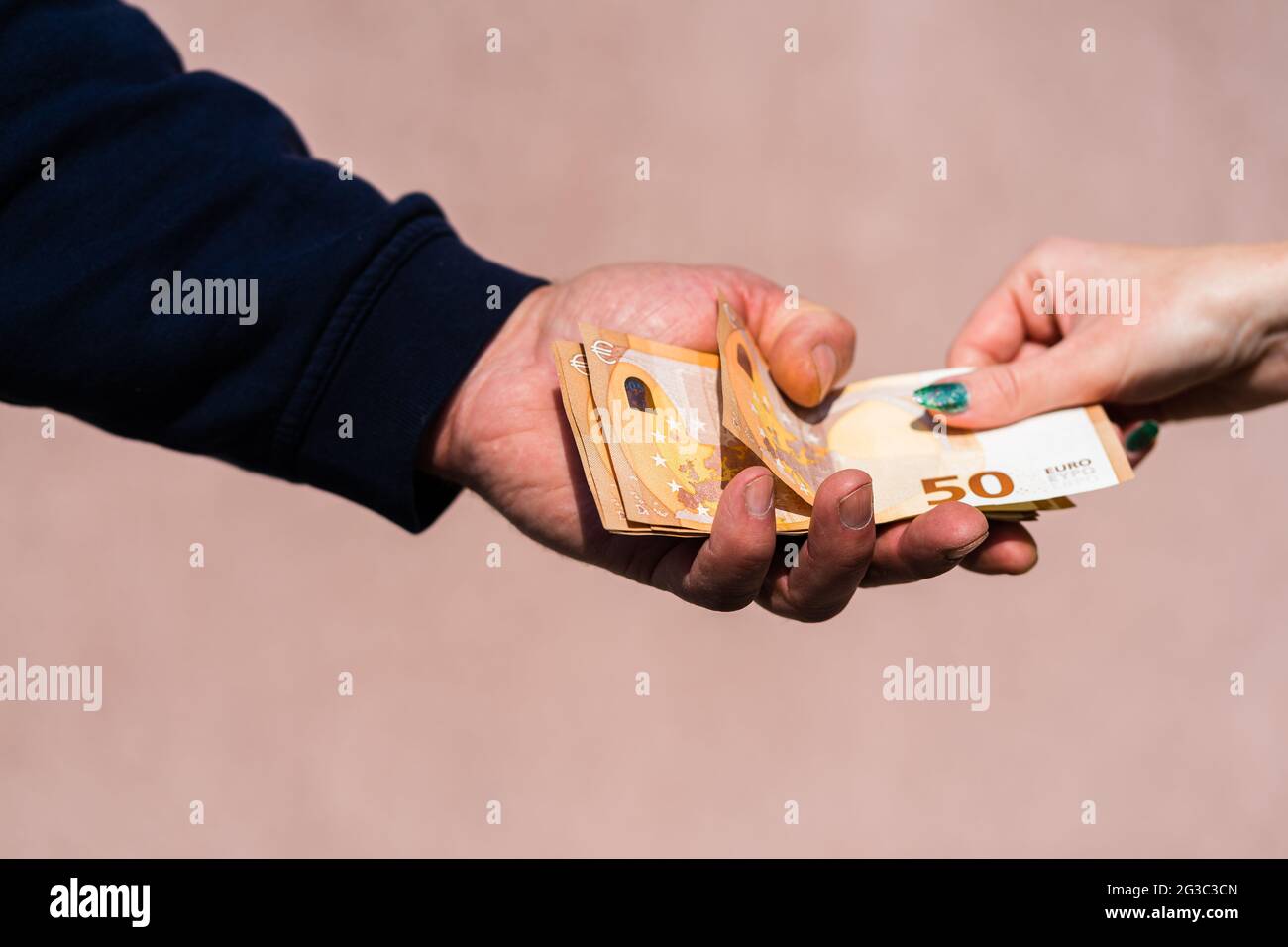 Hand giving money like bribe or tips or salary isolated, hard worked ...