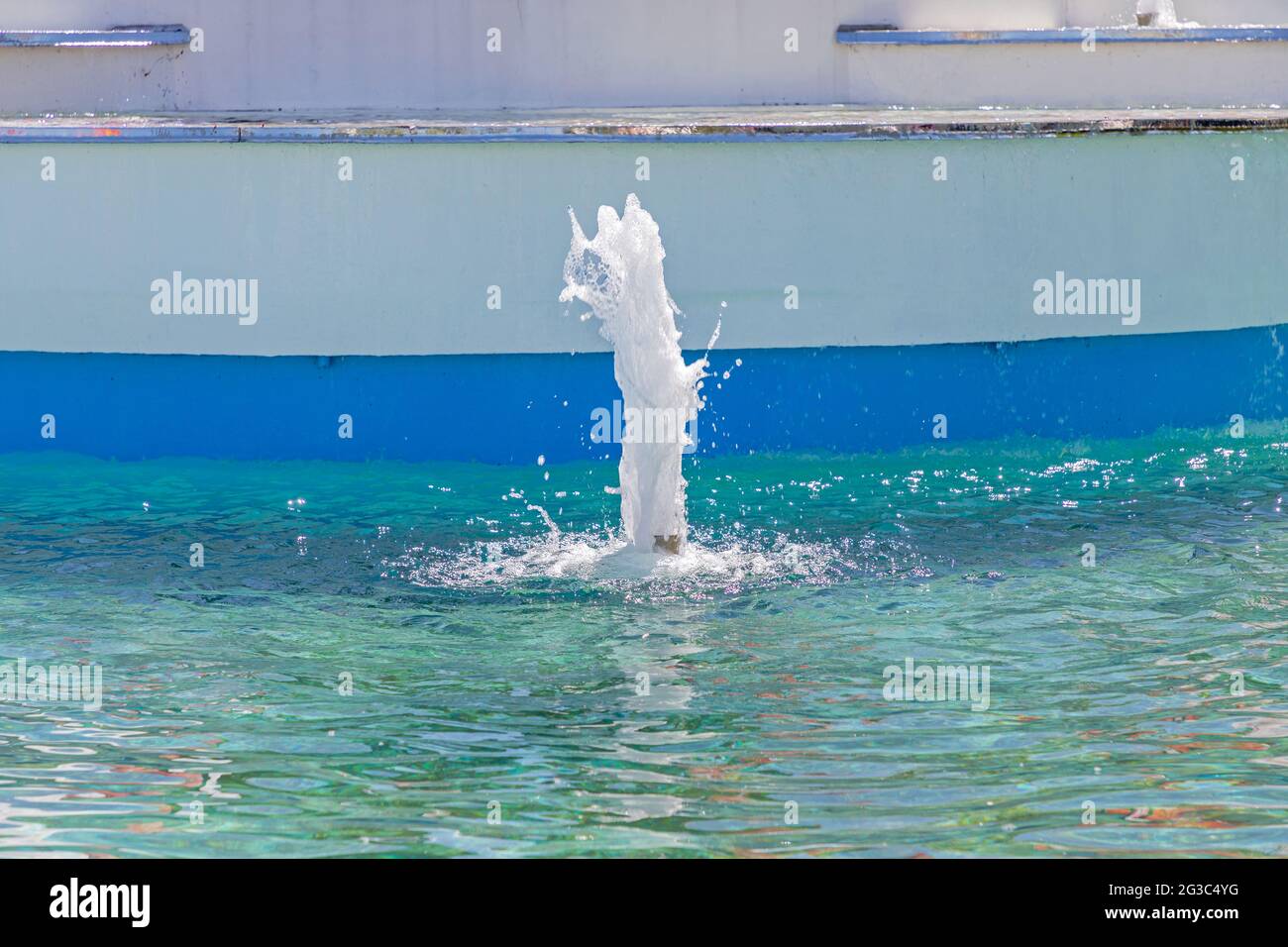 One Water Geyser Jet in Blue Water Fountain Stock Photo - Alamy