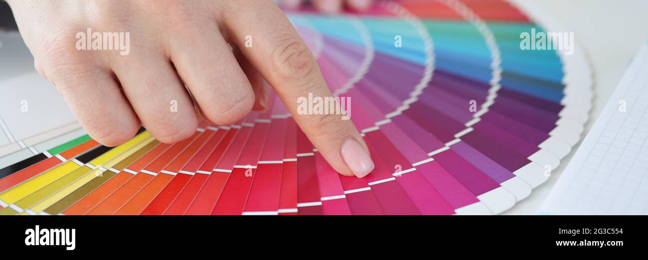 Designer holding color swatch at desk in office closeup Stock Photo - Alamy