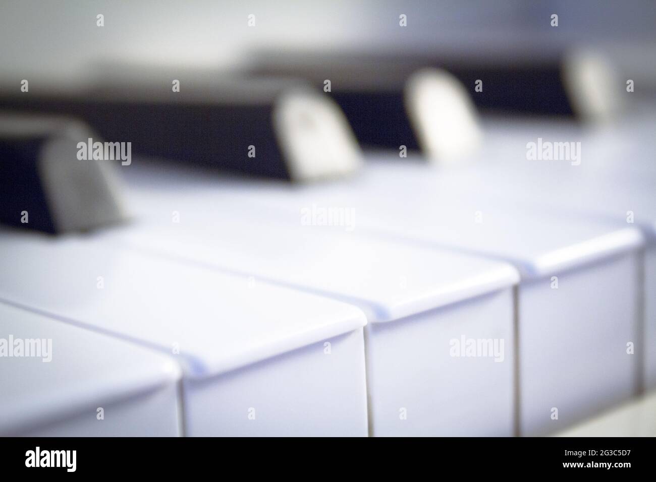 Part of the keyboard of a piano in white color. No people Stock Photo ...