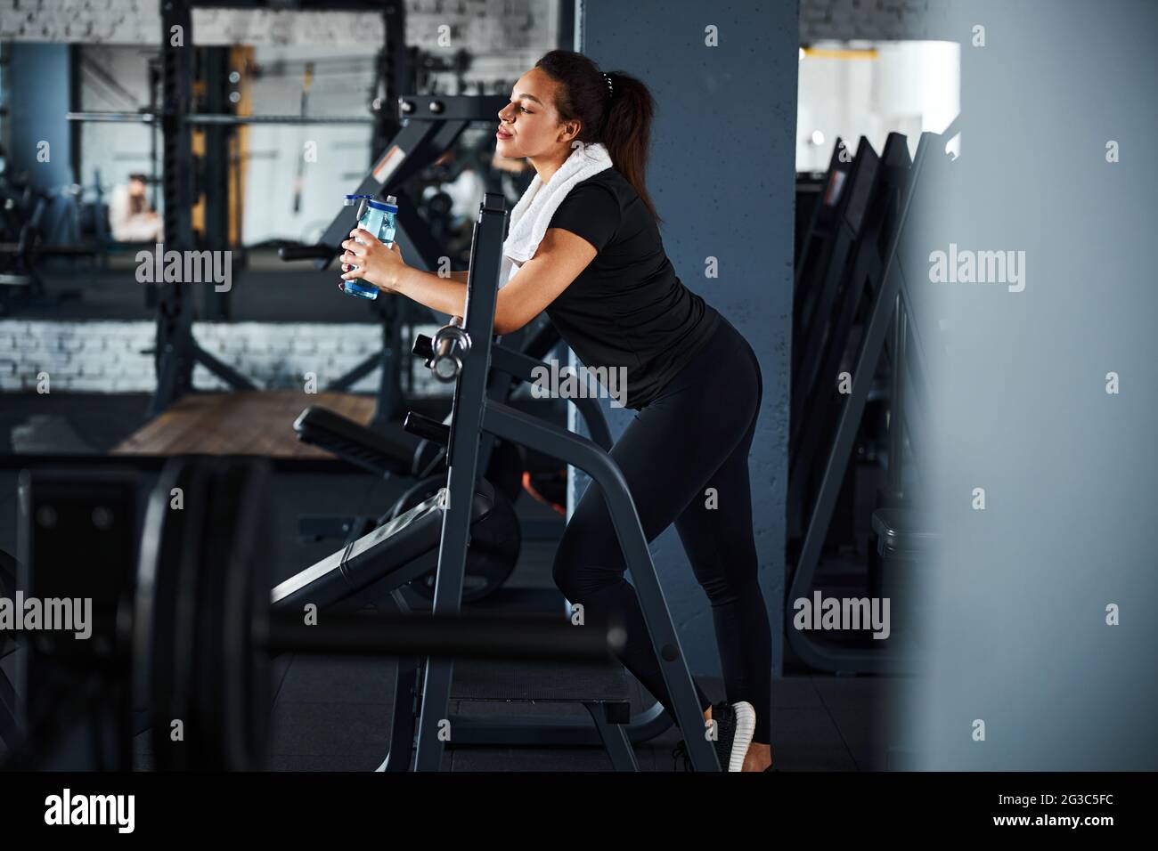 Athletic woman spending free time in gym Stock Photo - Alamy