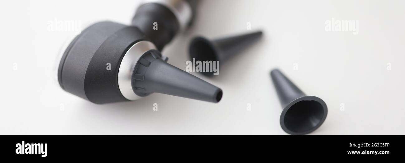 Closeup of otorhinolaryngologist otoscope tool on white background ...