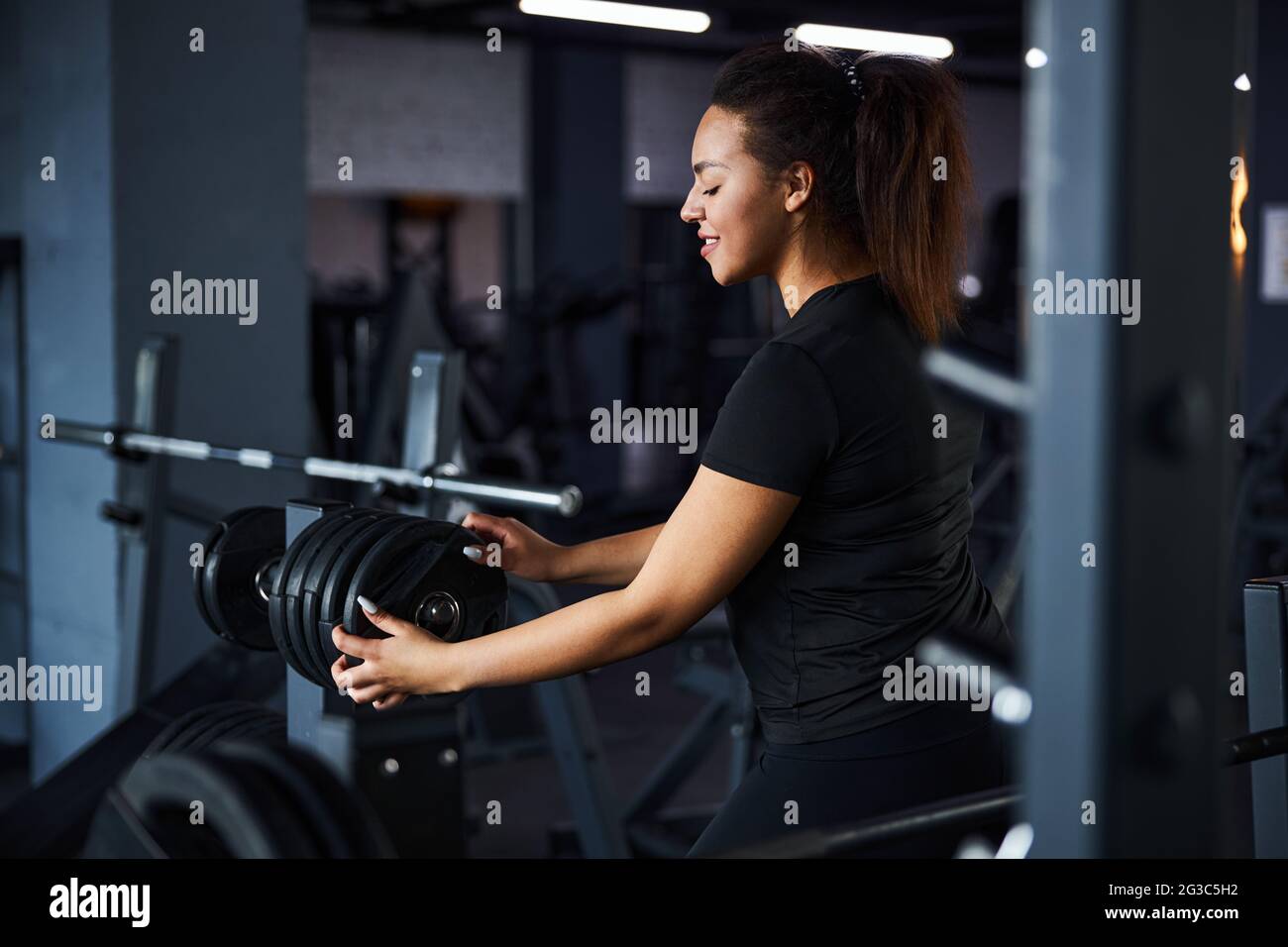 Woman preparing workout fitness club hi-res stock photography and ...