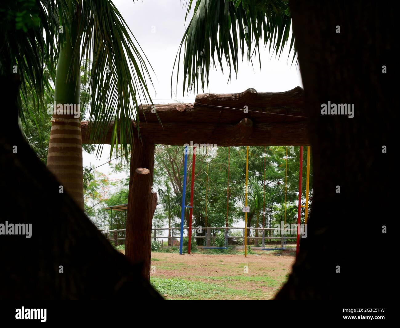 Asian park entry gate picture behind tree frame for natural ...
