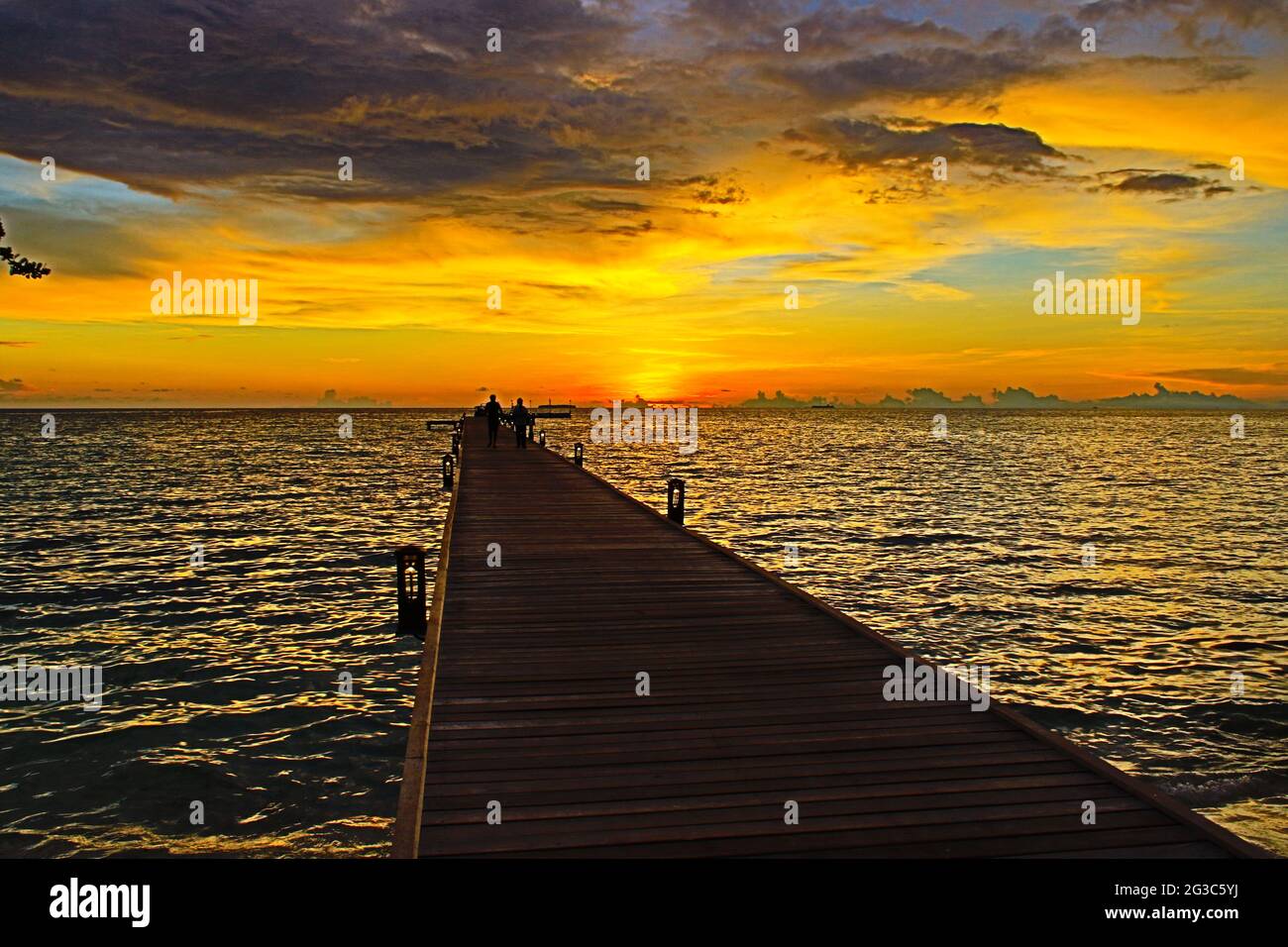 Wooden pier under colorful sunset skies ,Fun Island Resort ,Bodufinolhu ...