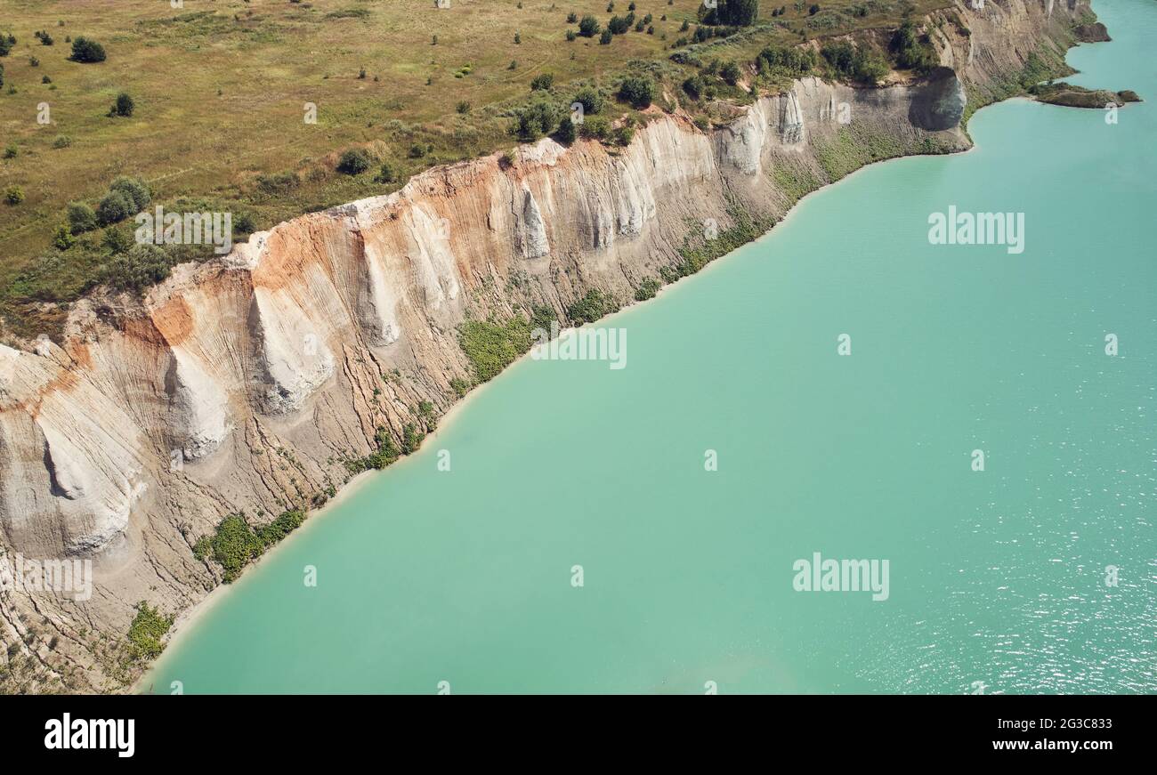 Big cliff in quarry on bright sunny day aerial above top view Stock ...