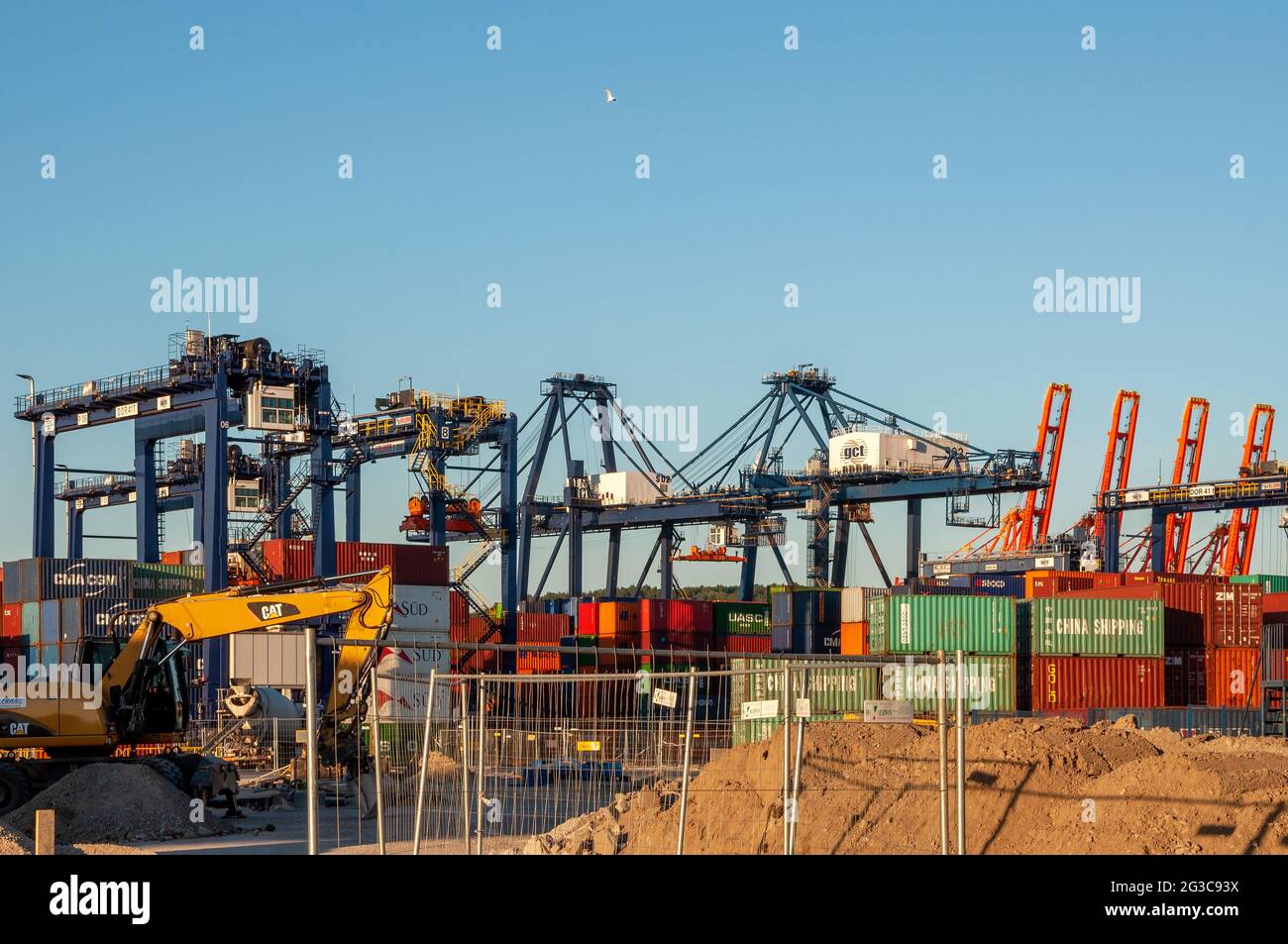 Containers and cranes in Gdynia harbour in Poland Stock Photo - Alamy
