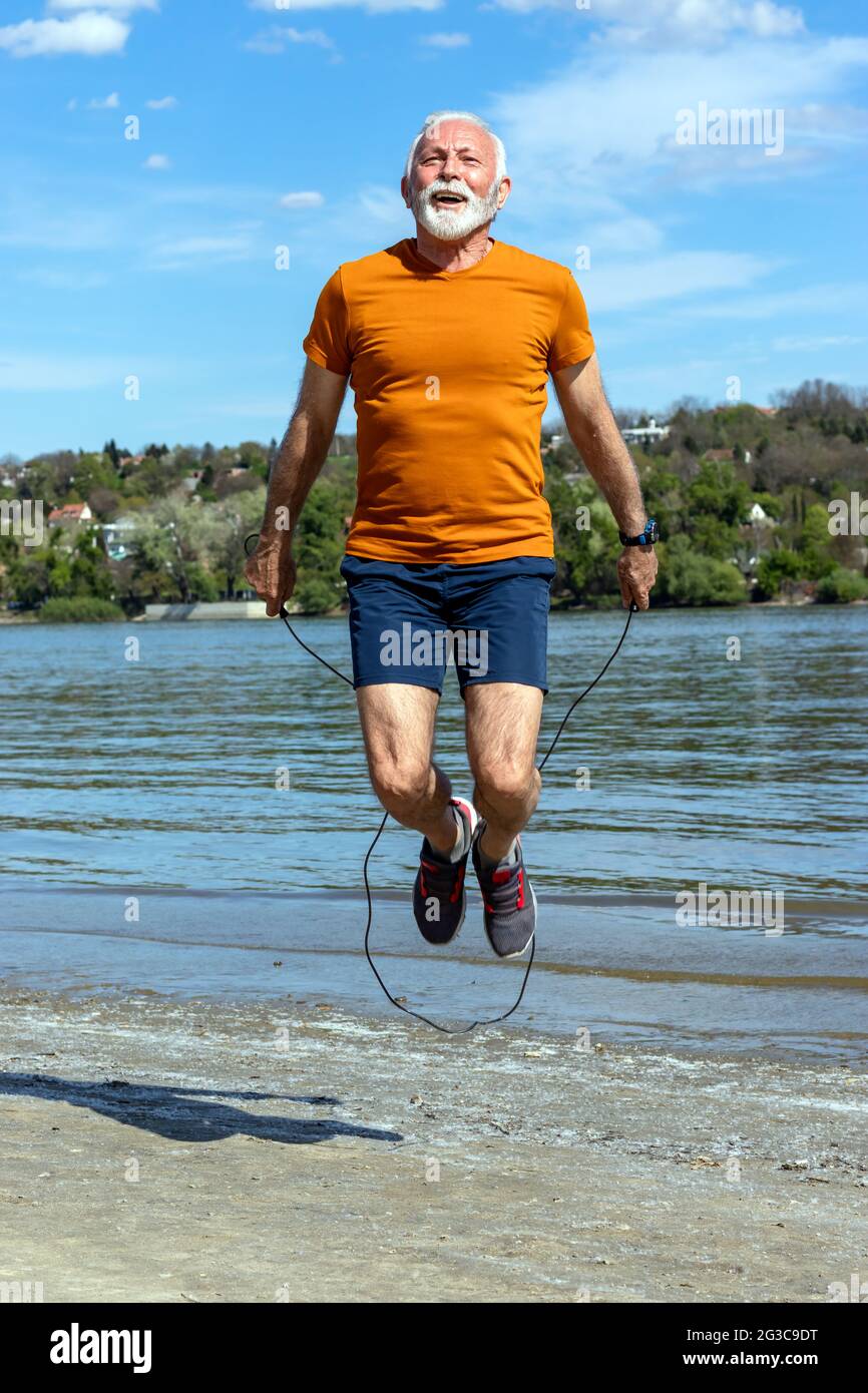 Man jumping rope and beach hi-res stock photography and images - Alamy