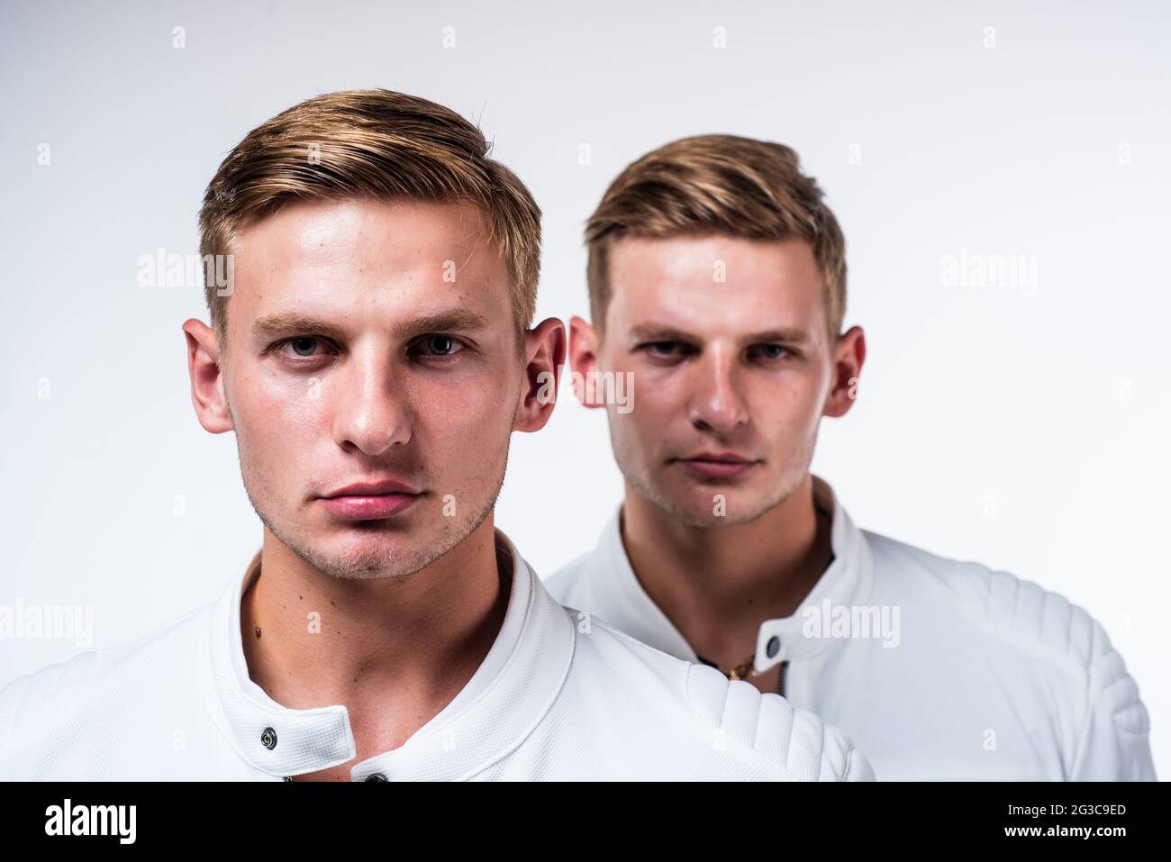 twin brothers men in white casual clothes look alike, brother Stock ...