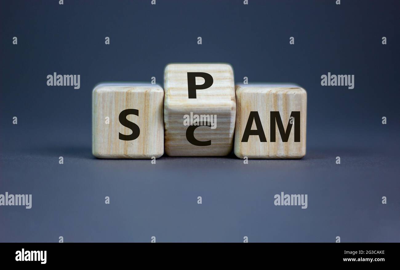 Spam and scam symbol. Turned a wooden cube and changed the word 'scam ...