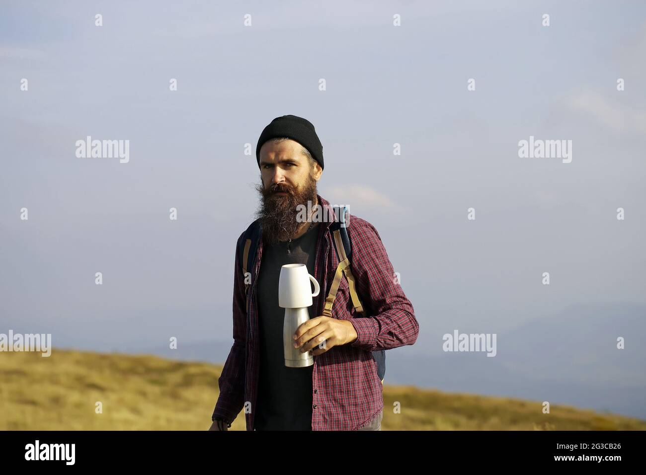 Bearded man with thermos Stock Photo - Alamy