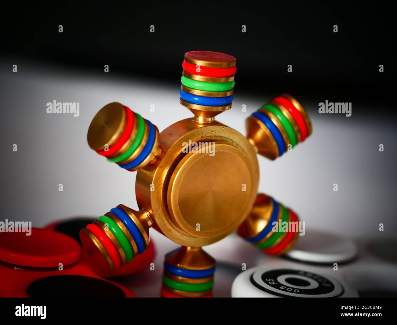 Playing colorful fidget spinner hi-res stock photography and images - Alamy