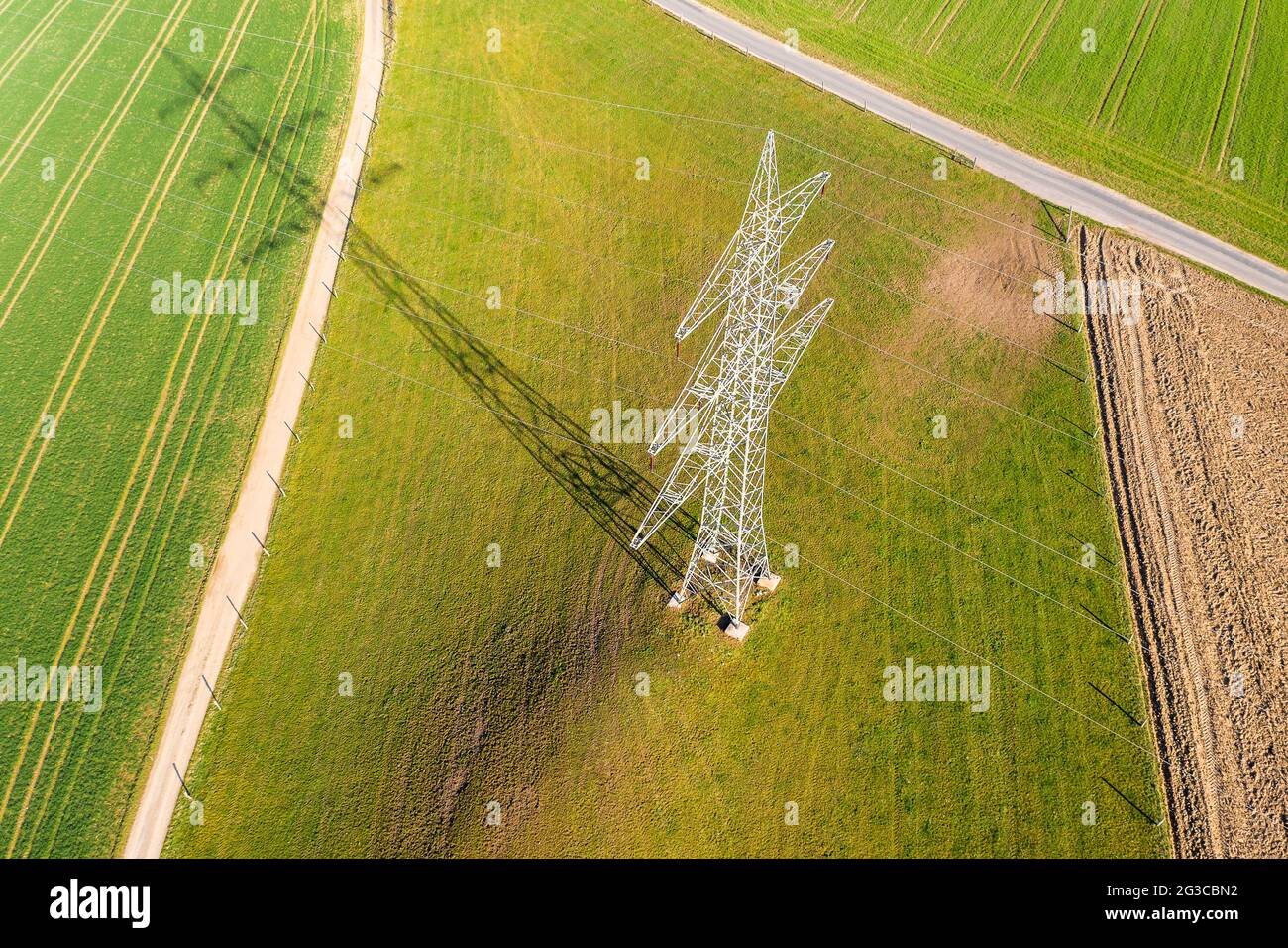 a high voltage pylon in the evening sun Stock Photo - Alamy