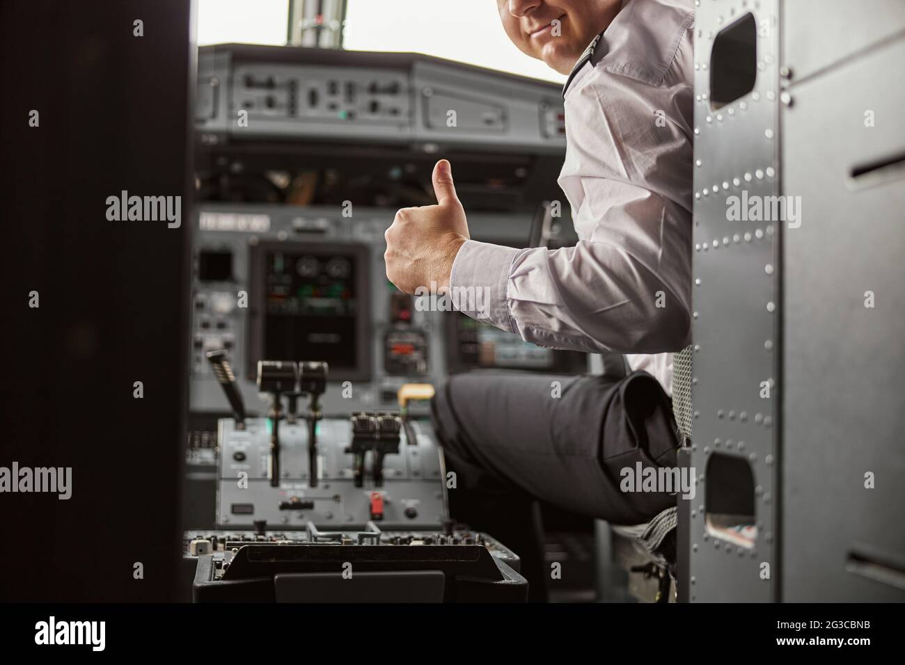 Pilot show thumb up gesture in cockpit of airplane Stock Photo - Alamy
