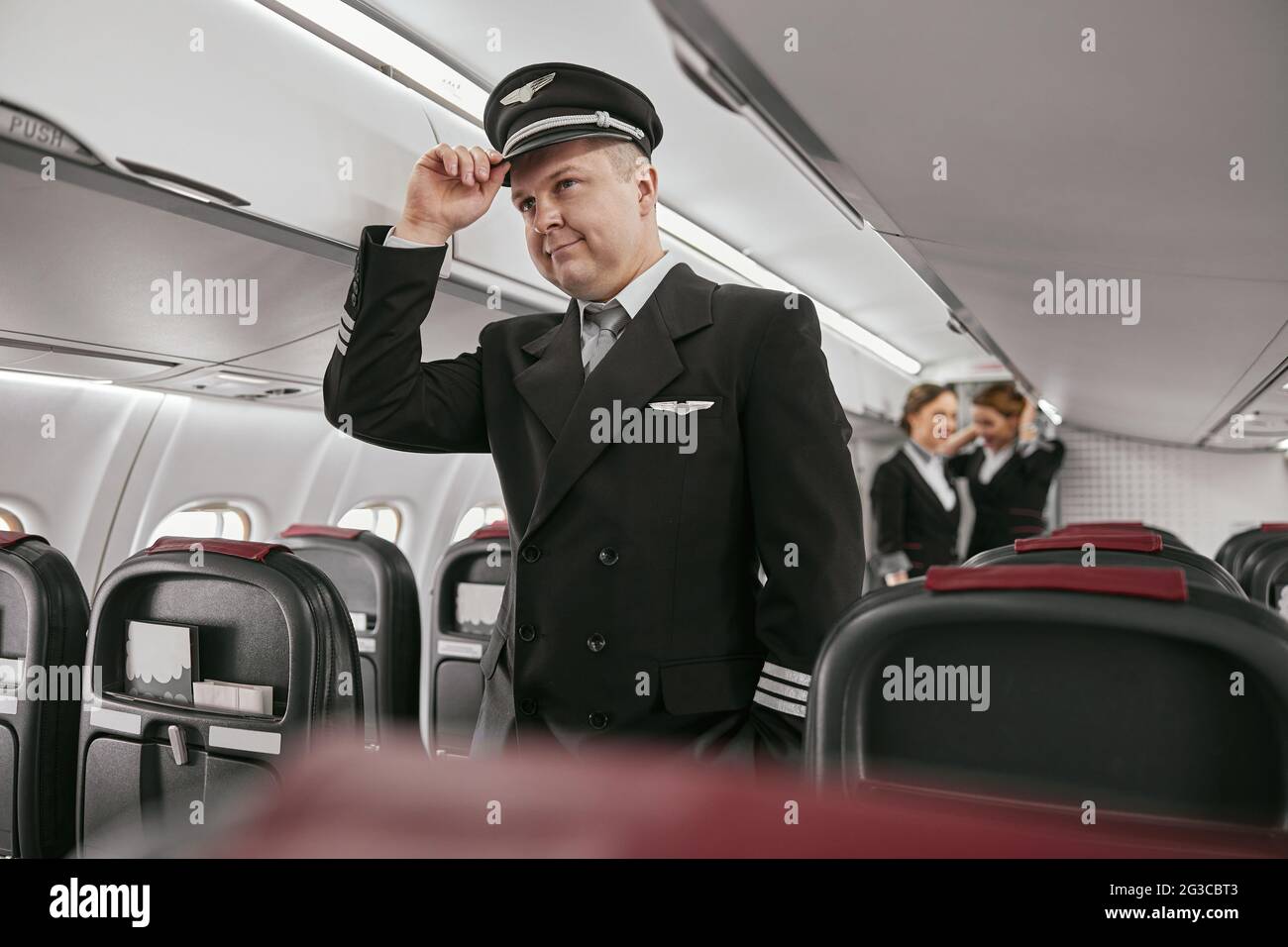 Pilot in passenger cabin of modern airplane jet Stock Photo - Alamy