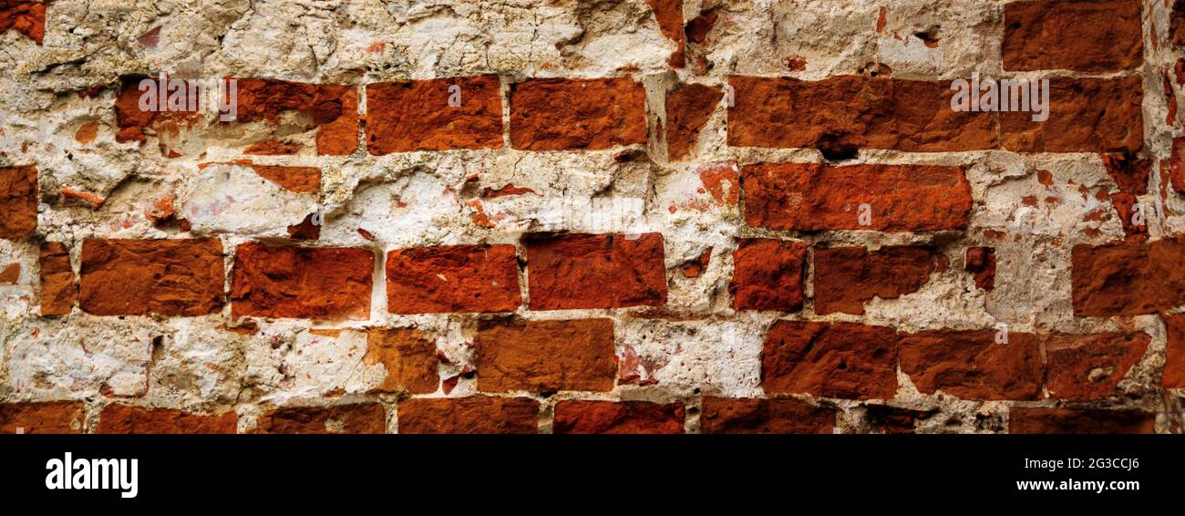 old wall of bright red brick with light seams Stock Photo - Alamy