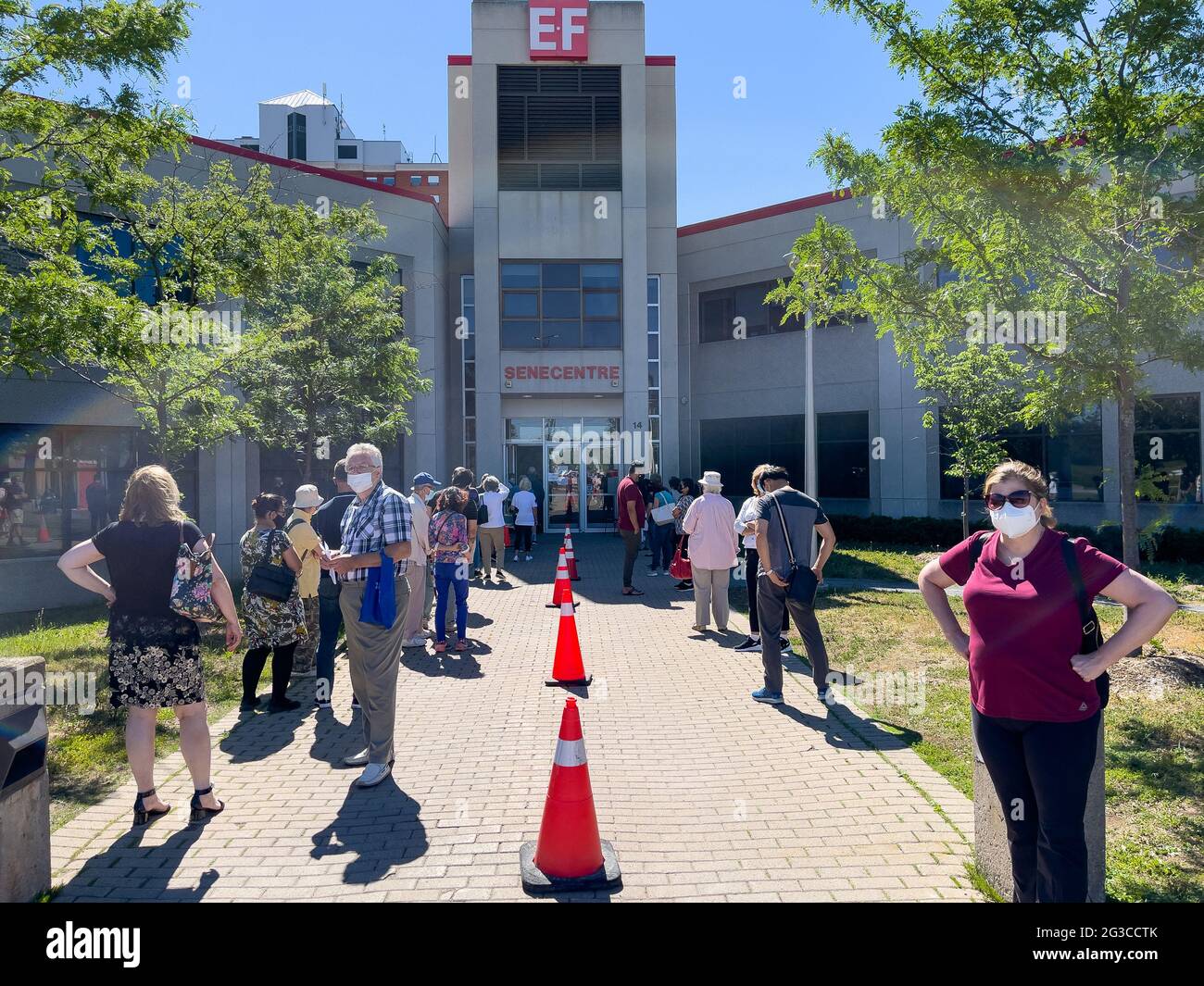 The line-up at a Covid-19 vaccination centre in Seneca College Newham ...