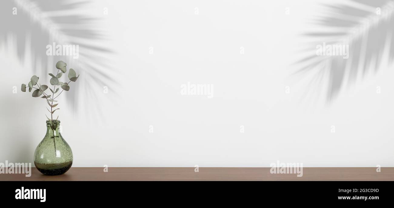 Empty home desk table background. Wooden table with a vase and a plant ...