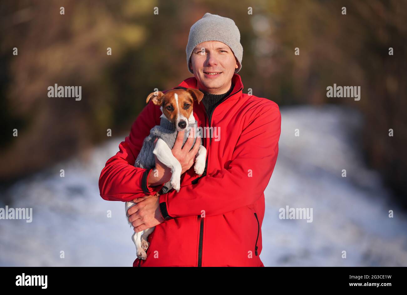 Man carrying dog on hands hi-res stock photography and images - Alamy