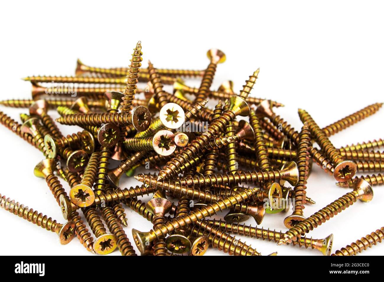 yellow self-tapping screw on a white background. A large number of ...