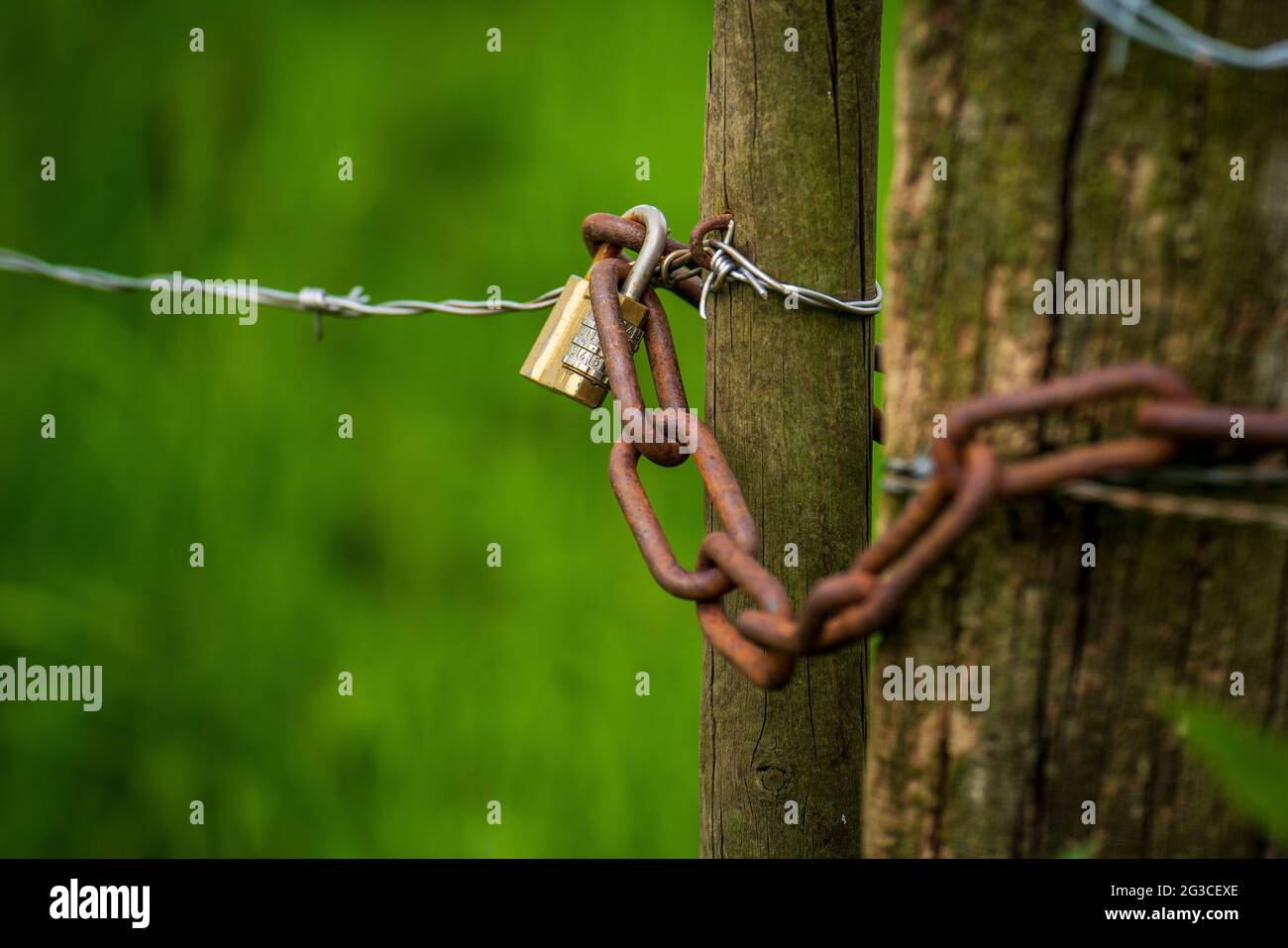 Padlock with a three digit combination on a fence Stock Photo - Alamy