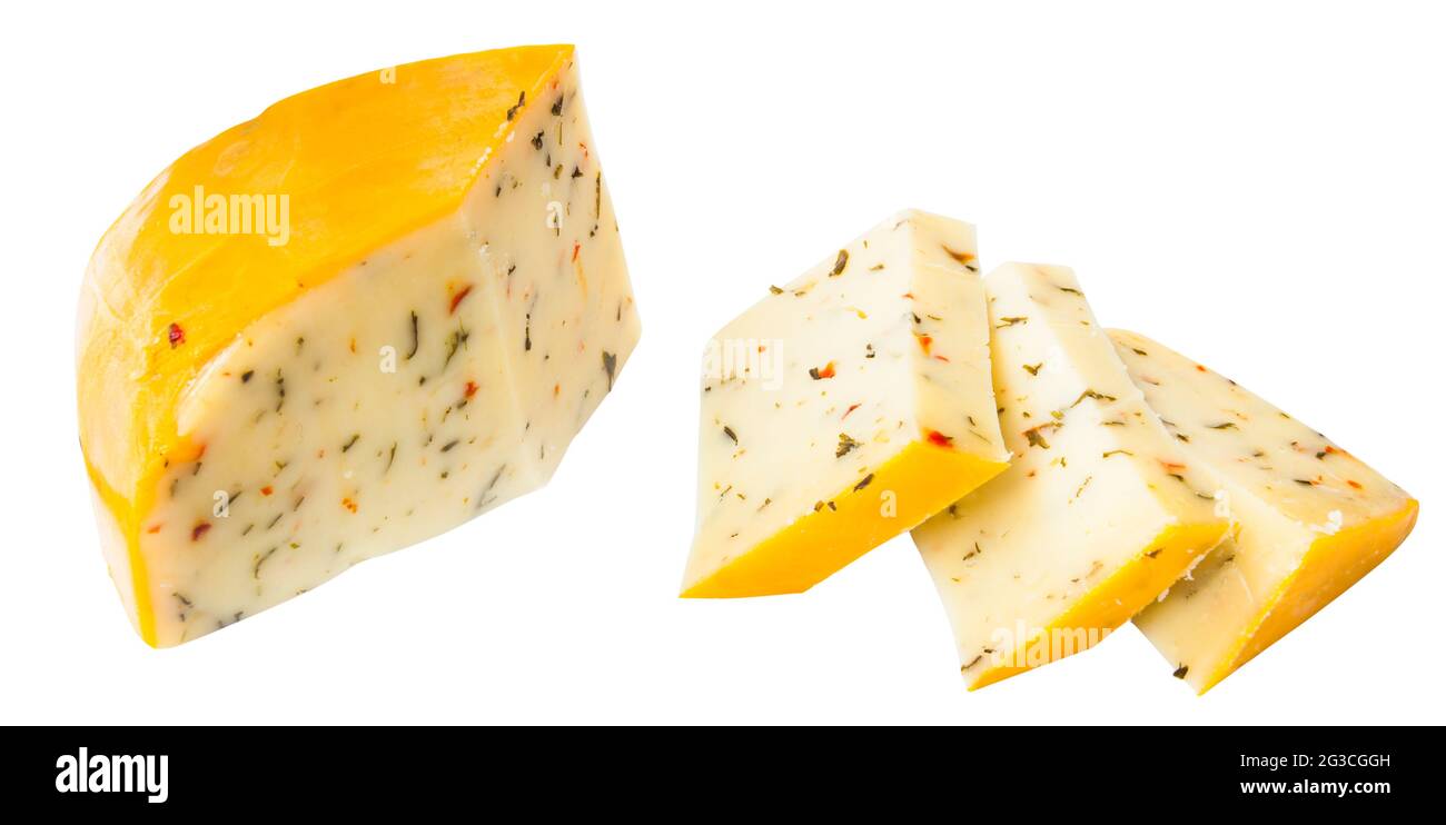 slices of gouda cheese with herbs. sliced and isolated on white ...