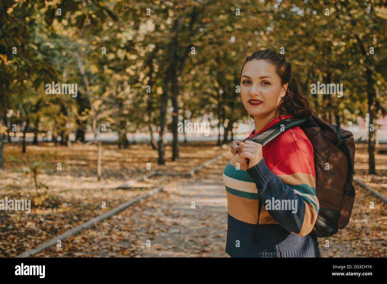 Young plus size traveler girl with backpack traveling along Europe ...