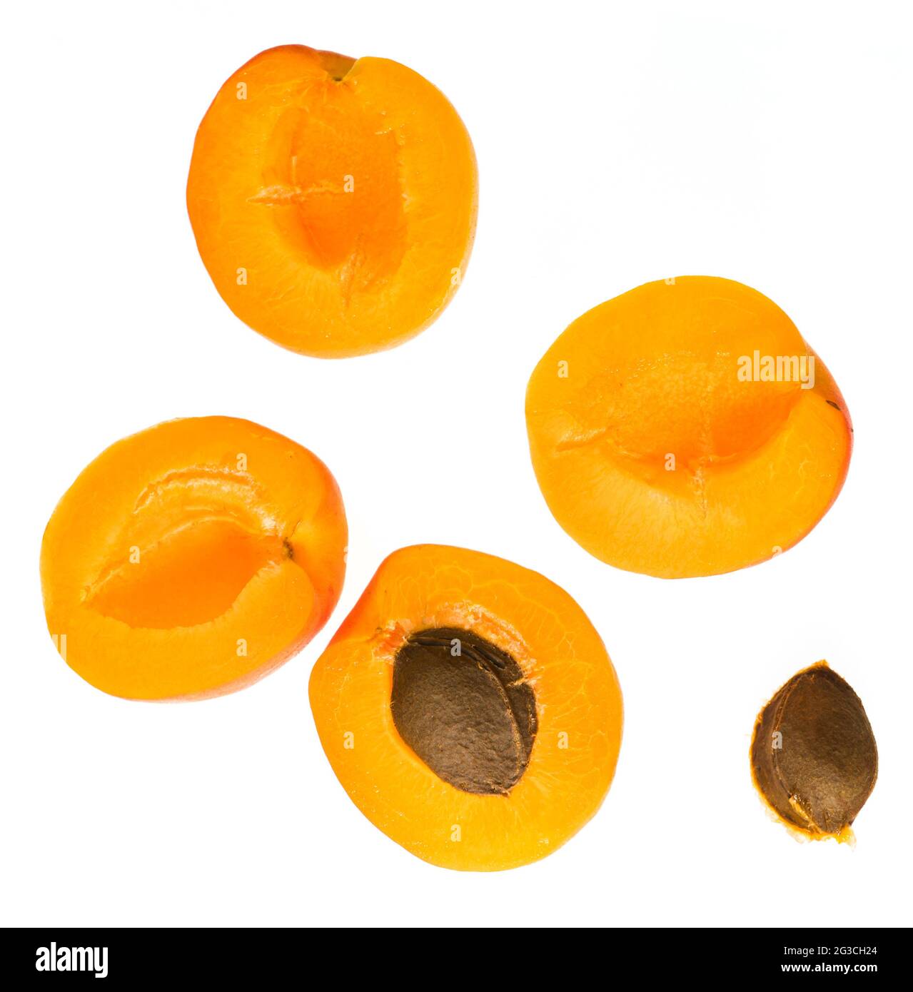Four separate parts of a ripe apricot fruit, on a white background ...