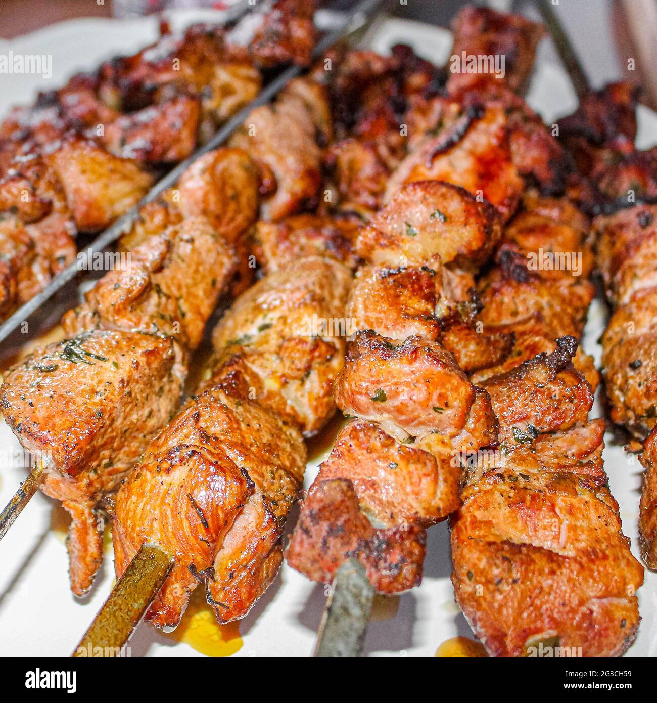 Russian shashlik with skewers on a white plate background in Norway ...
