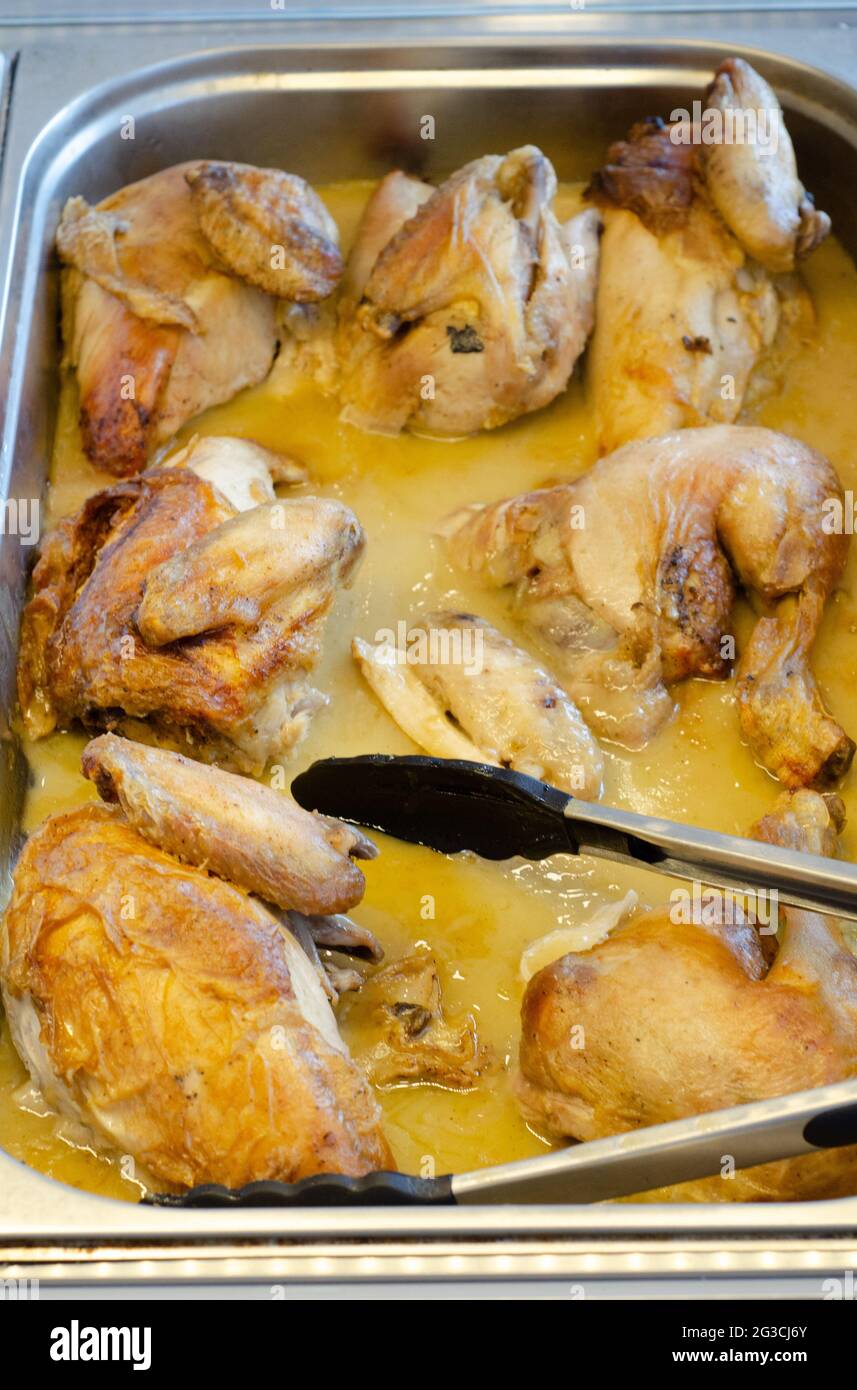 Buffet food container with chicken in bechamel sauce Stock Photo - Alamy