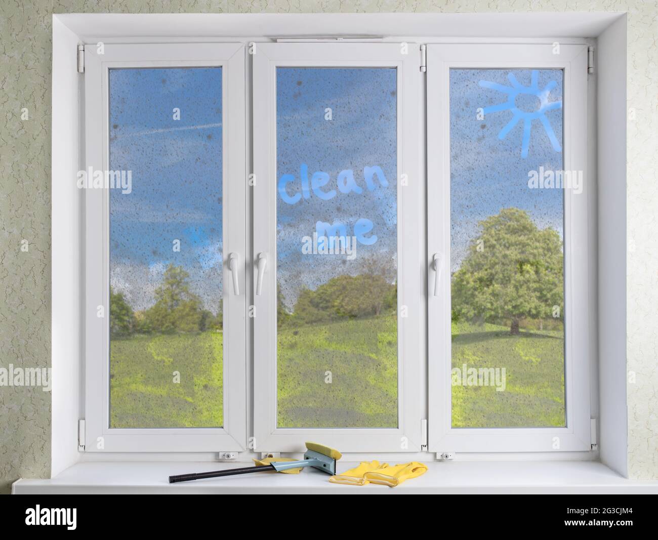 Cleaning modern PVC windows with a hand-held squeegee concept Stock ...