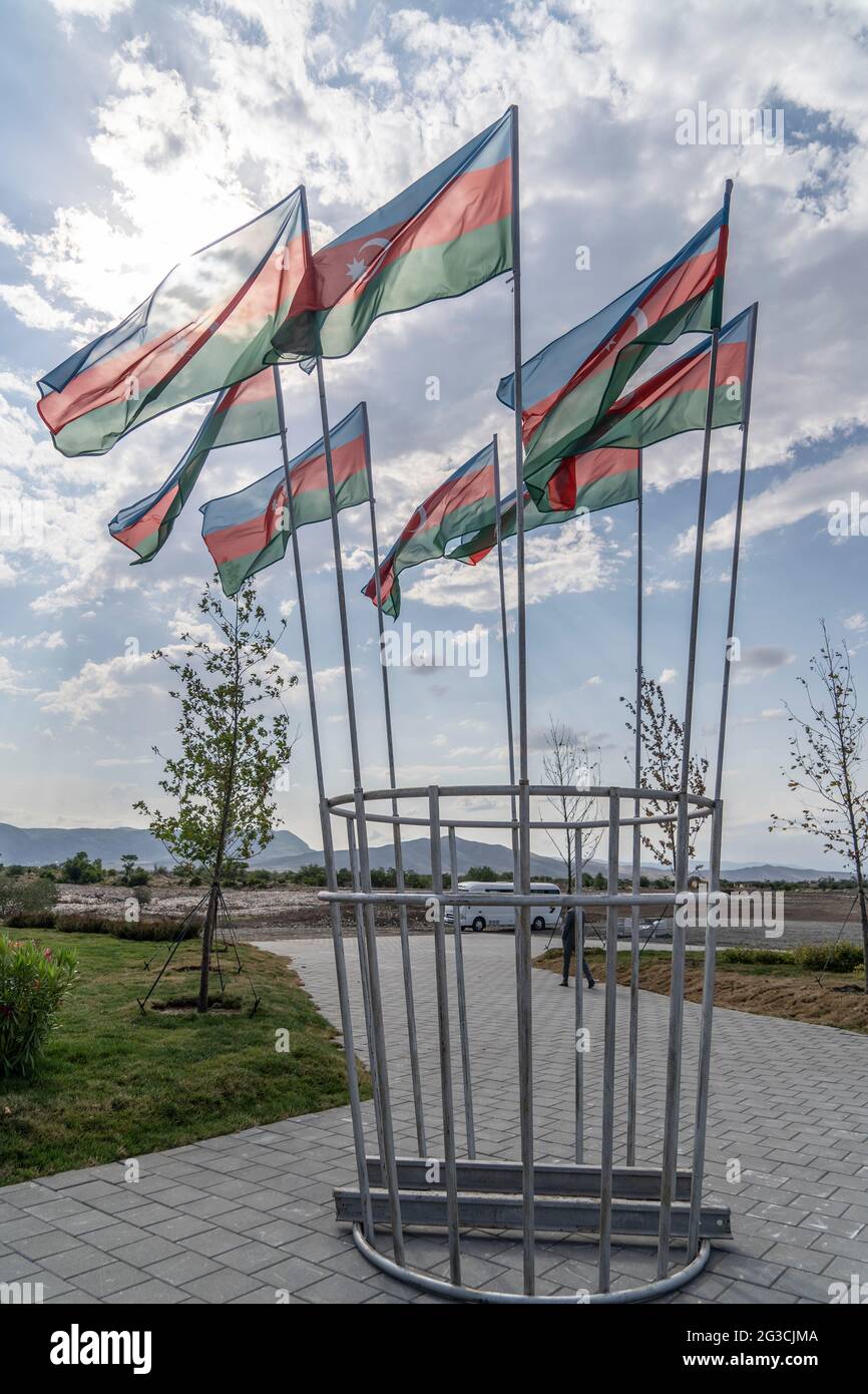 Azerbaijan flags fly in the newly recovered land during the event.A ...