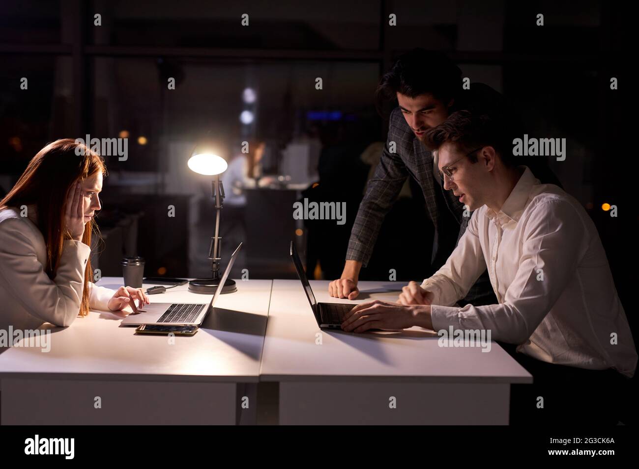 Business manager and employees work together on project, using laptop ...