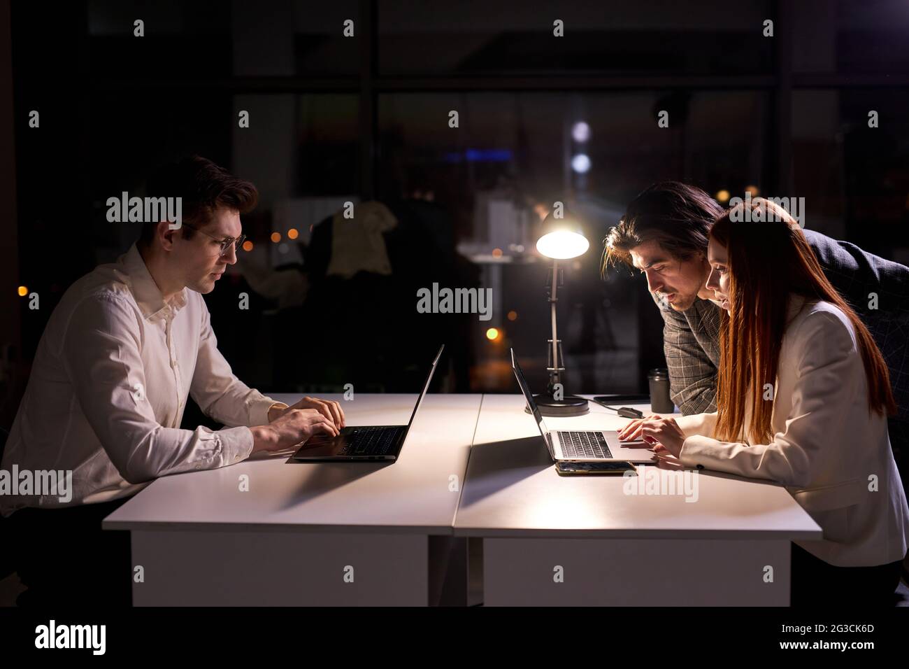 Business manager and employees work together on project, using laptop ...