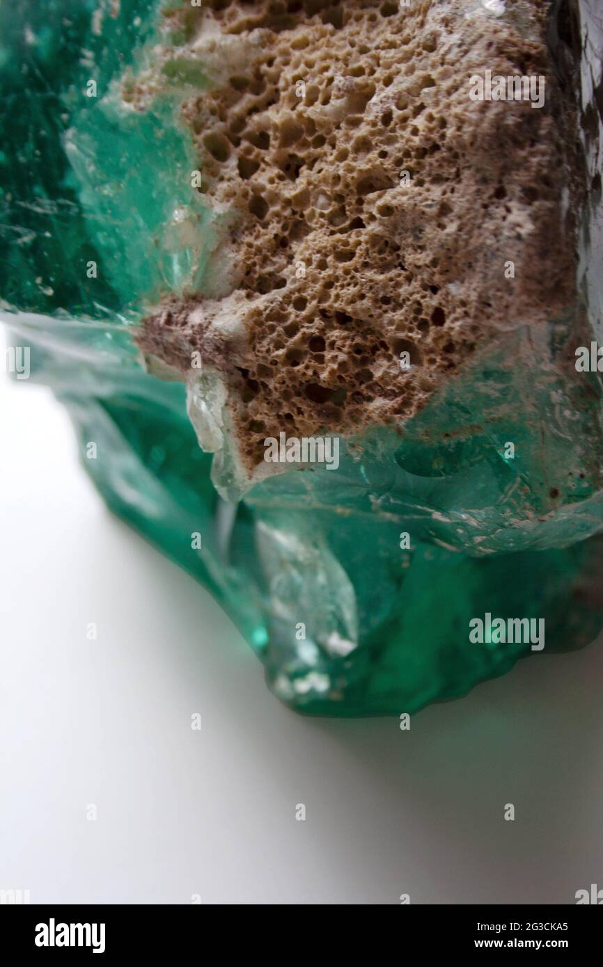 Textured turquoise glass rock detail on white background Stock Photo ...