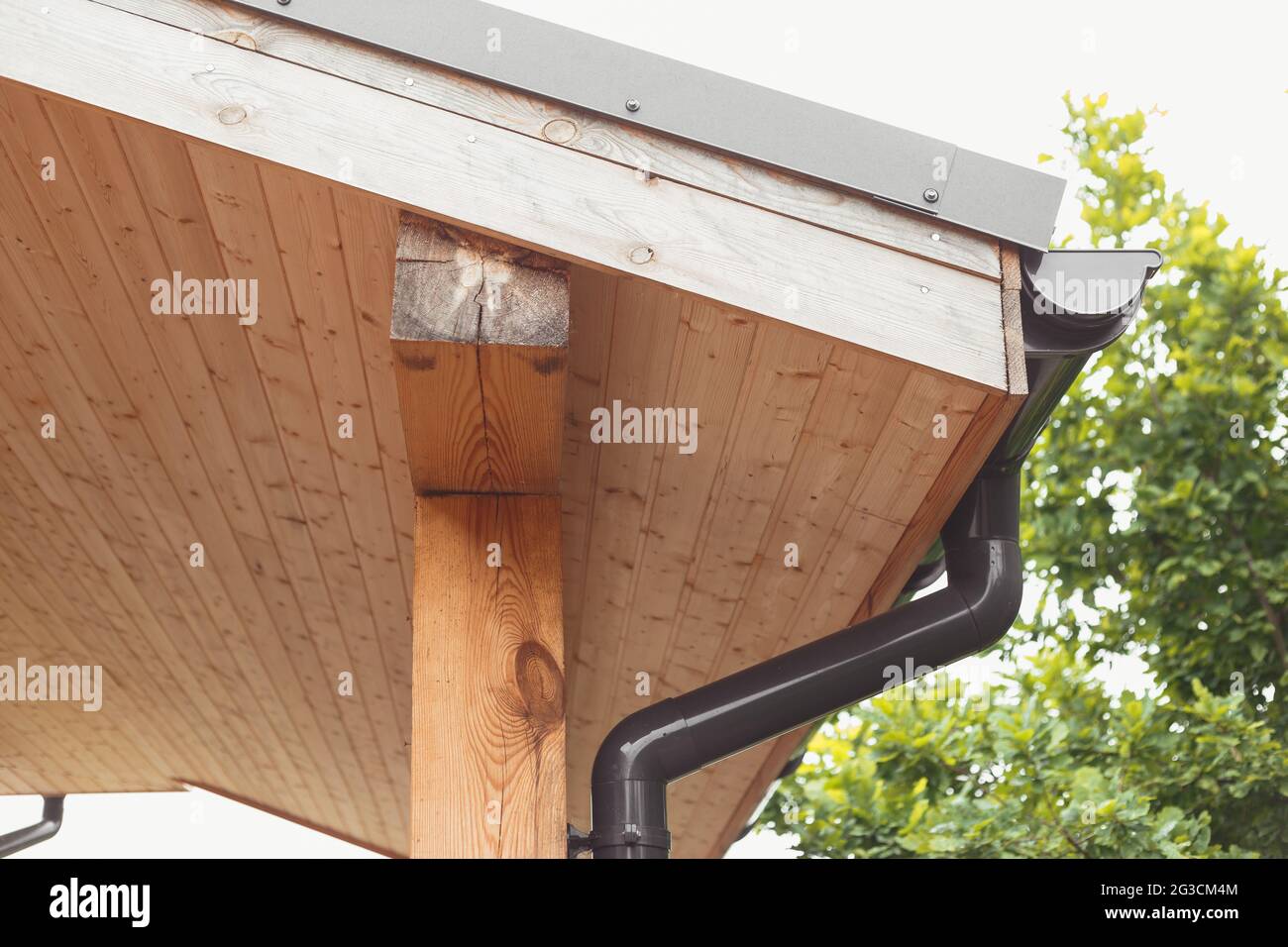 Polymer storm drainage system with a gutter on the roof of a private ...