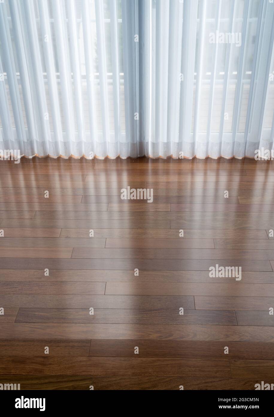 Vertical blinds cast shadows on a newly installed Brazilian Cherry ...