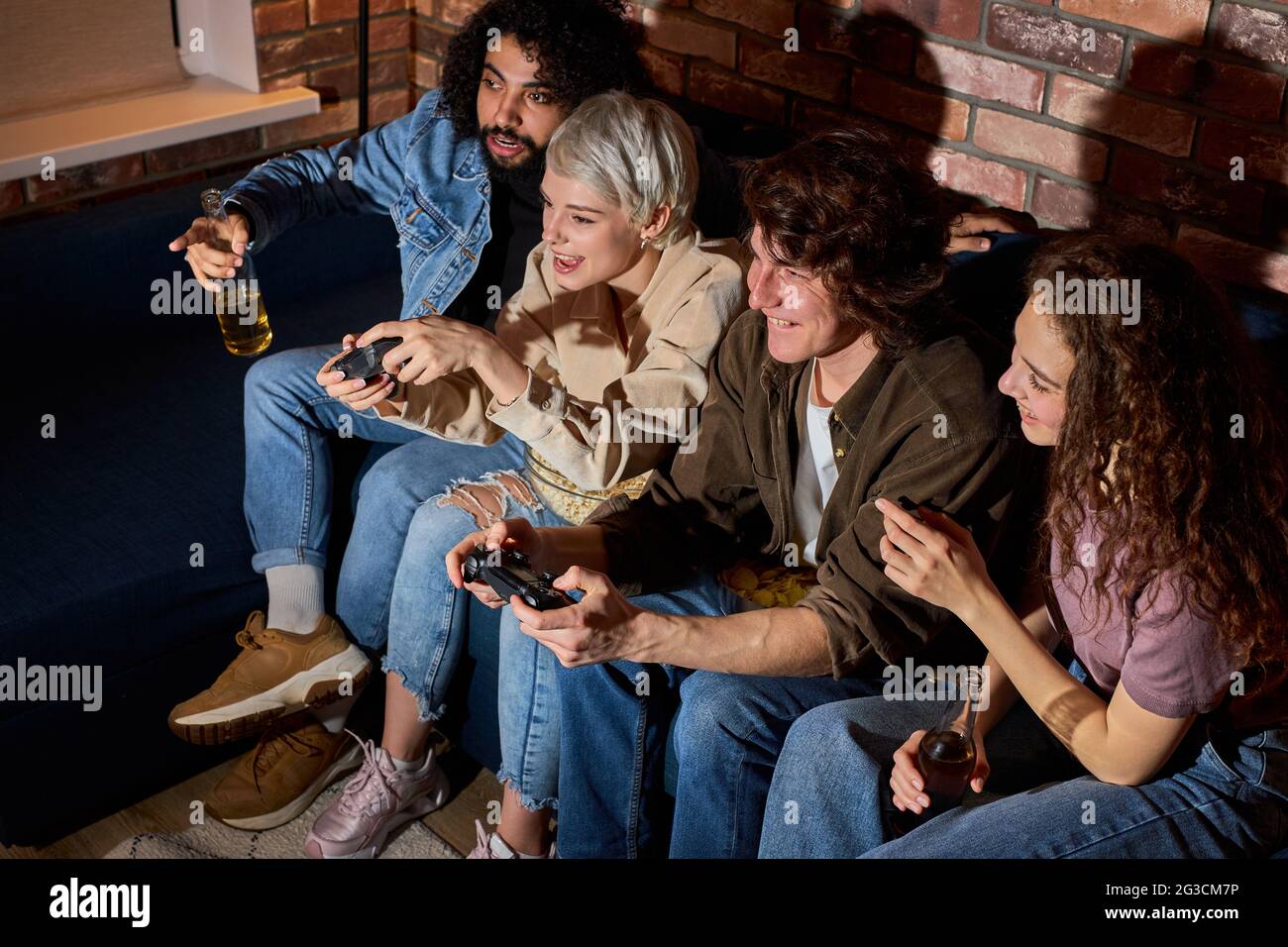 Diverse Students enjoying of playing in video game, rest at home ...