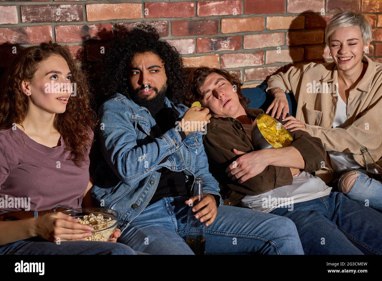 Bored Guy Sleeping While Diverse Friends Watching Movie Online On TV ...