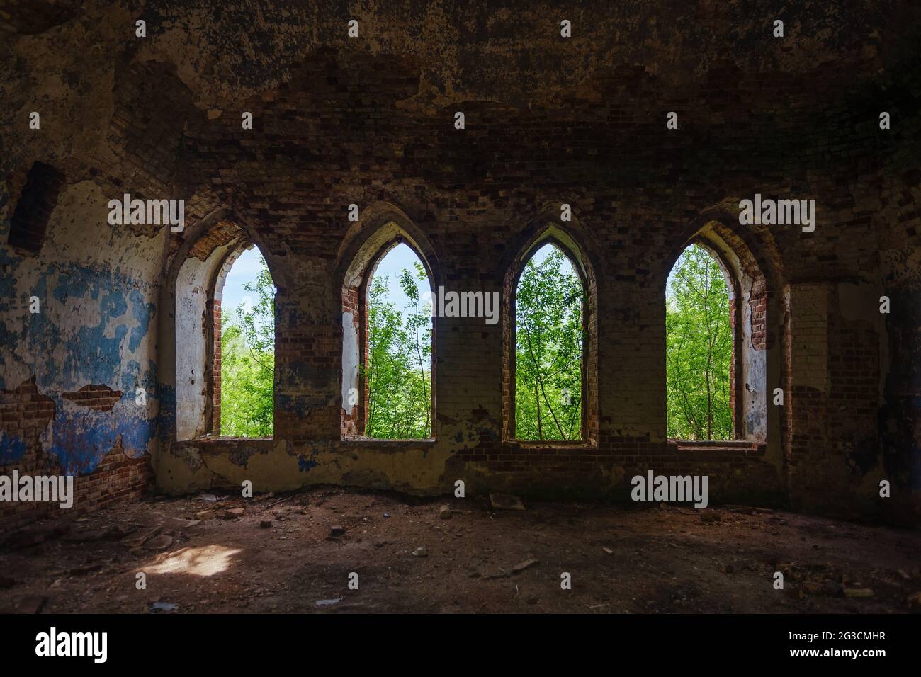 Burnt out shop after fire with charred walls and remains of furniture ...