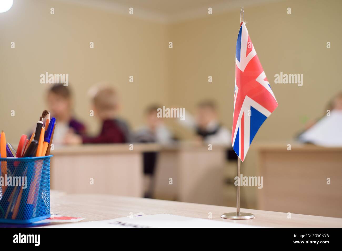 The UK flag is on the desk of the teacher classroom at the school Stock ...
