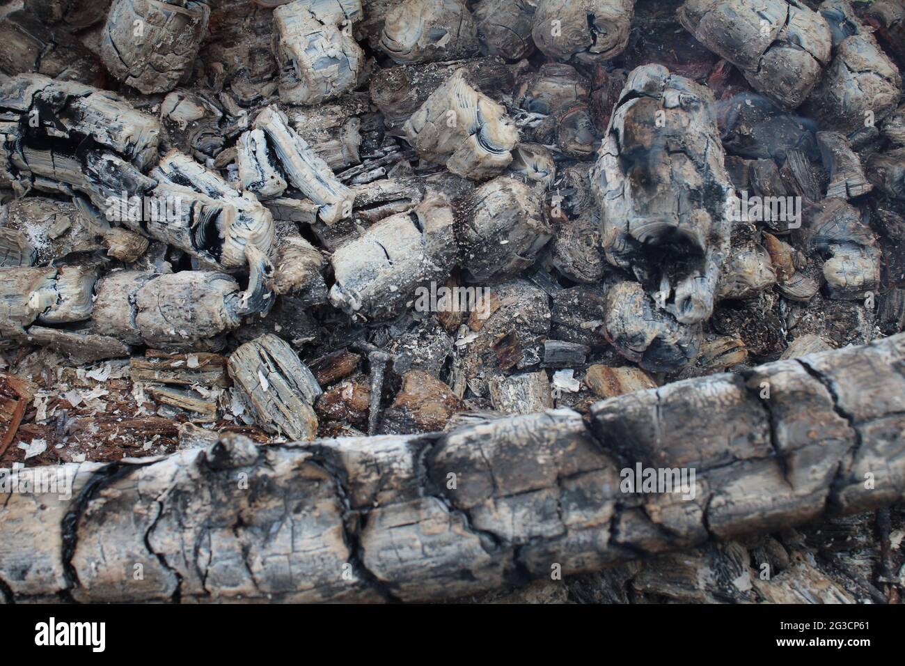 background and ash charcoal gray blacks with red stained streaks close ...