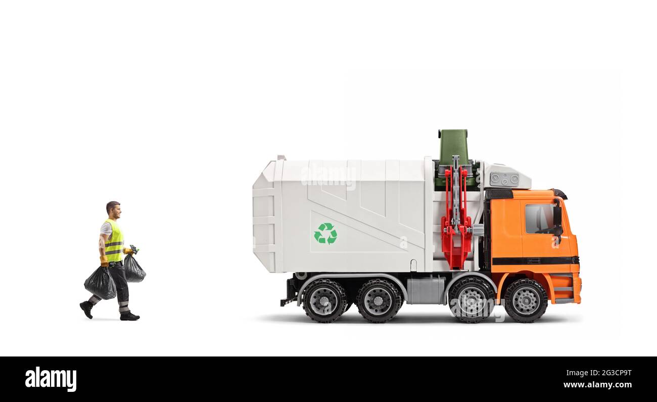 Waste collector carrying bin bags into a garbage truck isolated on ...